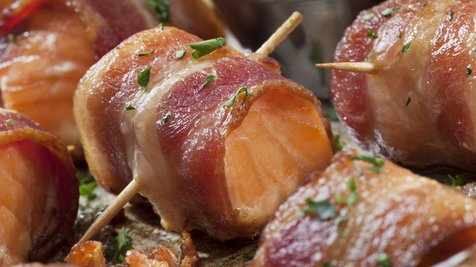 Bacon Is The Key To Adding Another Savory Protein Layer To Salmon Filets