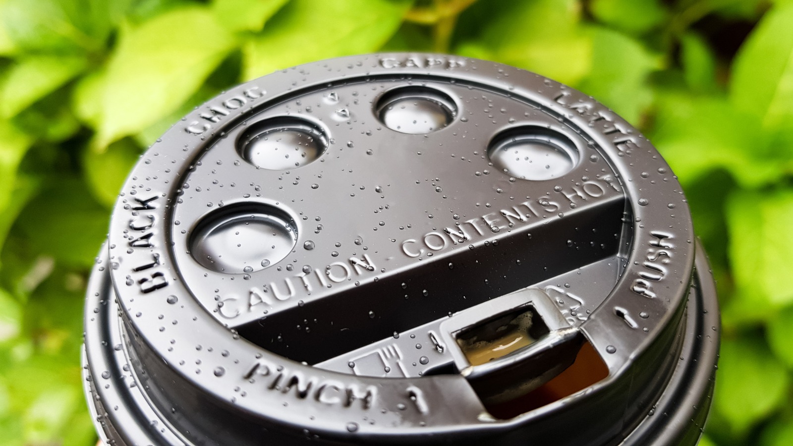 The Clever Reason Plastic Drink Lids Have So Many Buttons