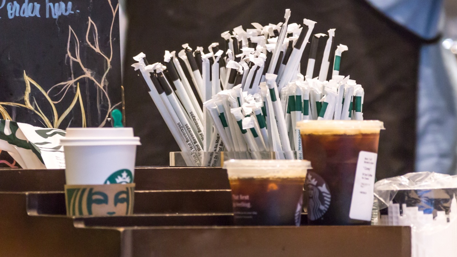 The Reason Some Starbucks Stores Keep Straws Behind The Counter