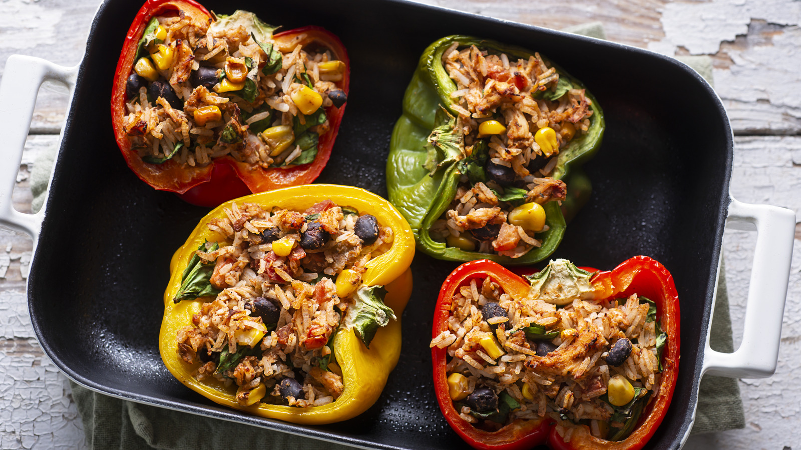 The Trick To Ensure Your Stuffed Peppers Don't Tip Over While They Bake