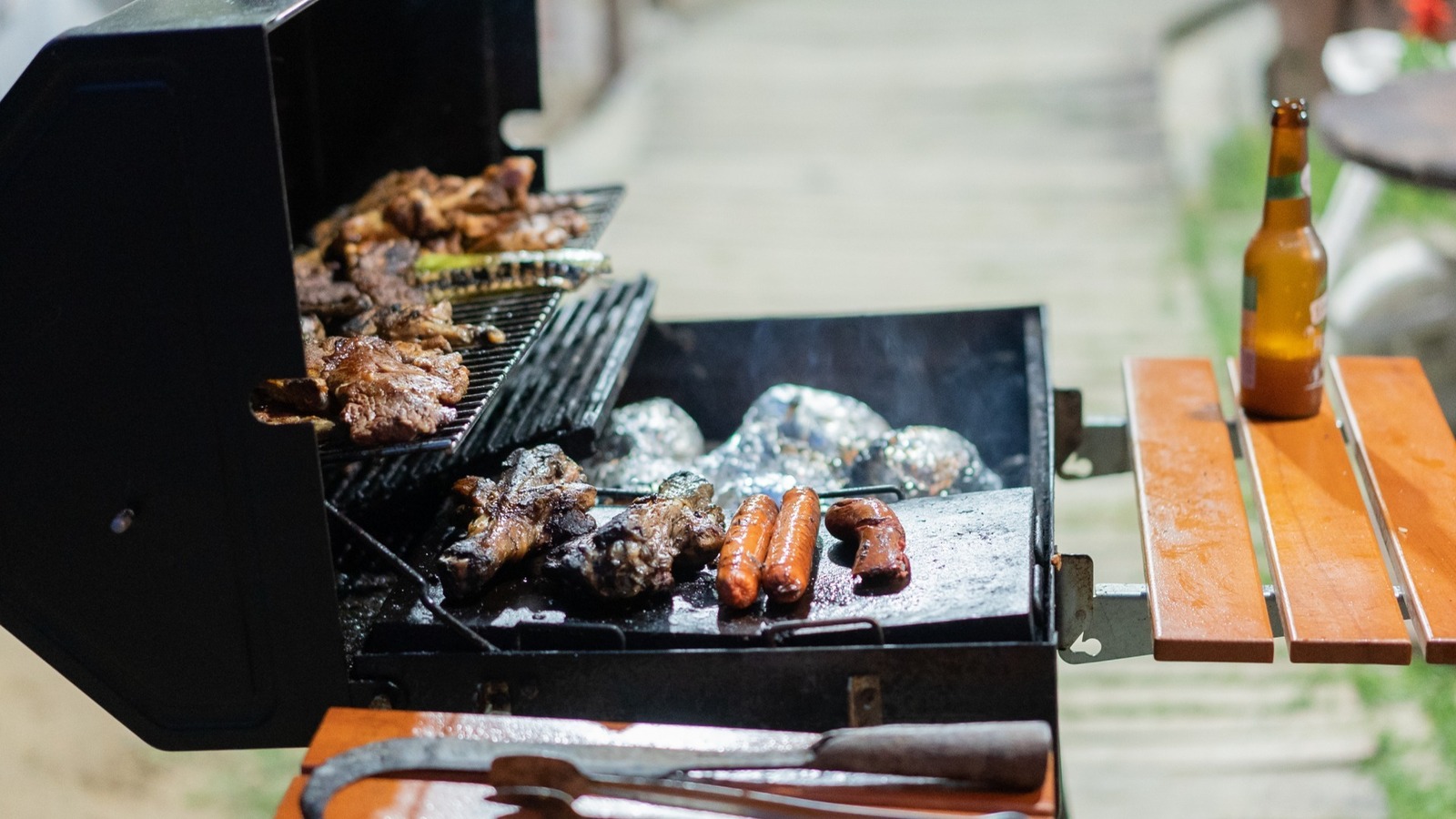 Use Your Grill's Upper Shelf To Give Food A Smokier Taste