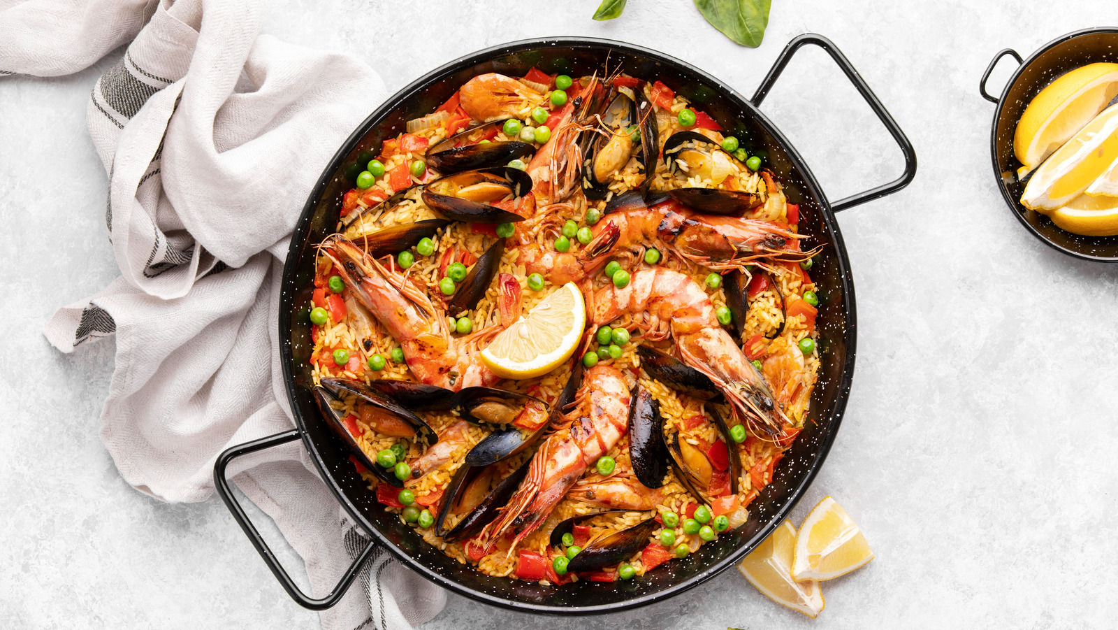 Why You May Want To Skip The Onions To Preserve Paella's Texture