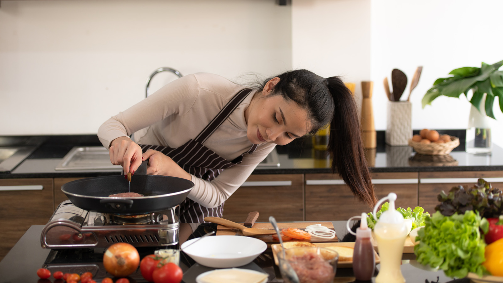 Why Your Smashed Burgers Actually Should Be Sticking To The Pan